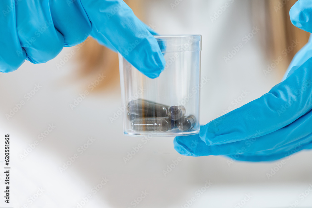 Medical innovation as a scientist meticulously prepares fecal ...