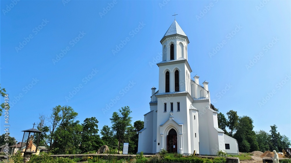 The historic church building with its dome and crosses is surrounded by ...