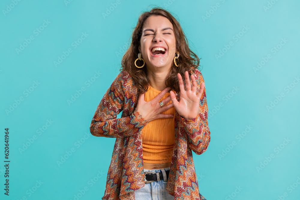 Amused lovely woman pointing finger to camera, laughing out loud ...