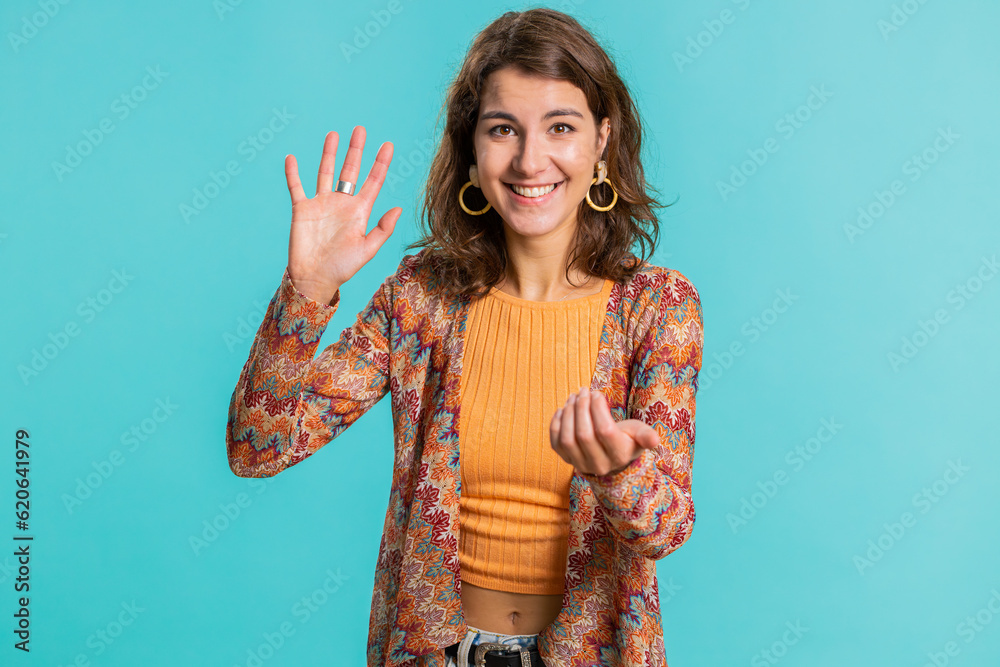 Come here, join us. Welcome. Brunette attractive woman showing inviting ...