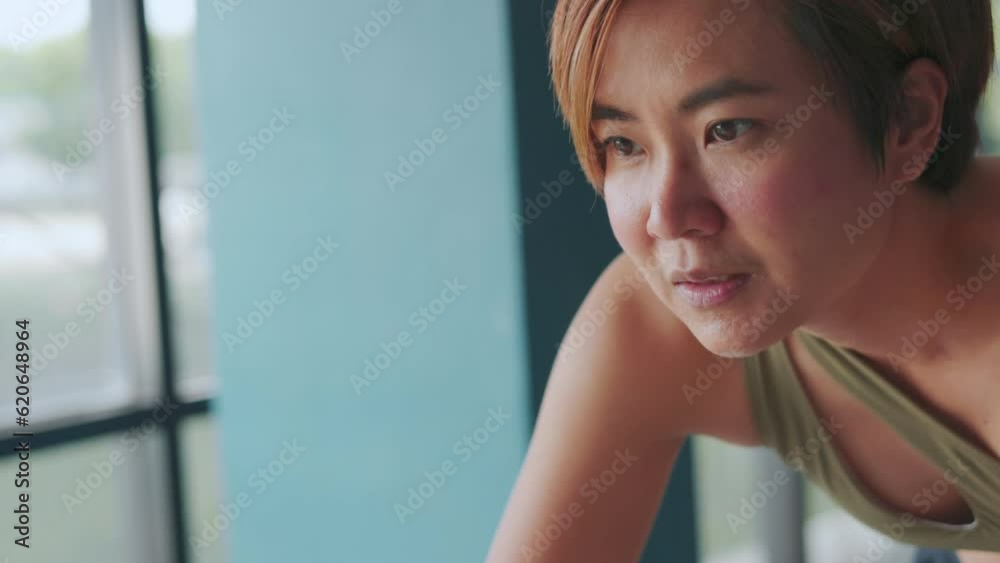 Muscle definition and determination of a short-haired beautiful Asian ...