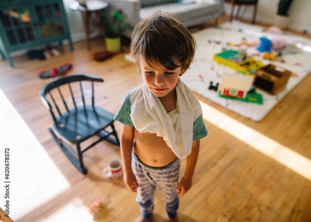 Frustrated boy tried to get dressed himself Stock Photo | Adobe Stock