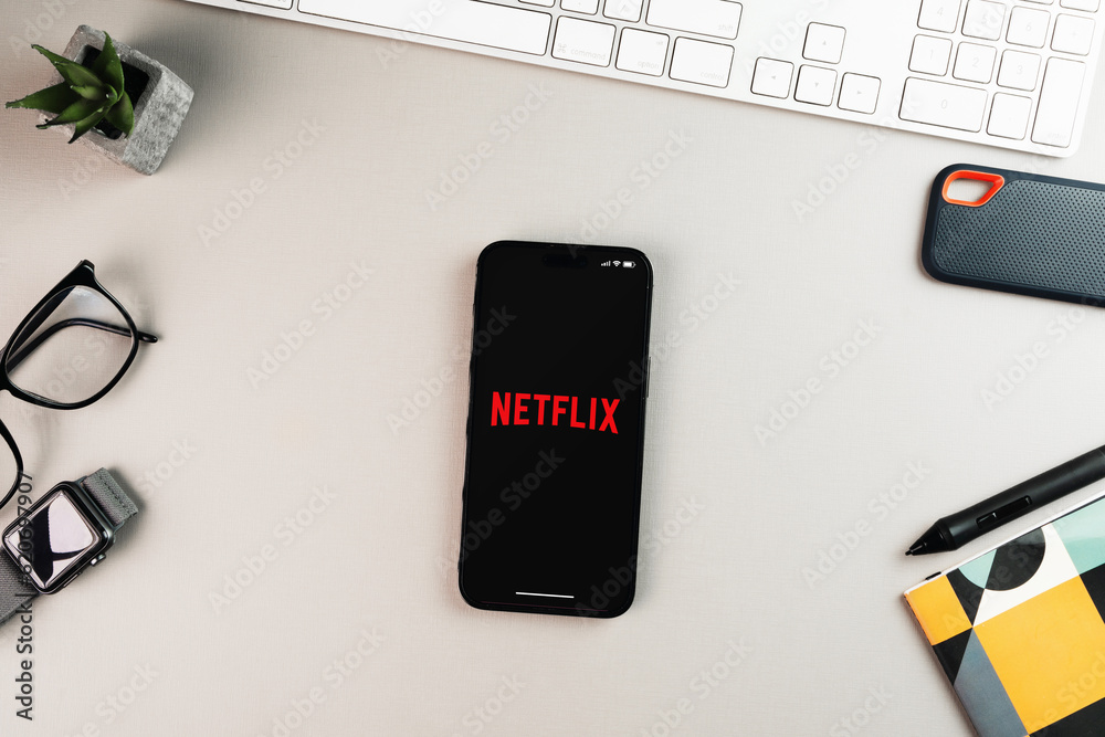 Netflix streaming app on the smartphone iPhone 14 Pro screen on gray ...