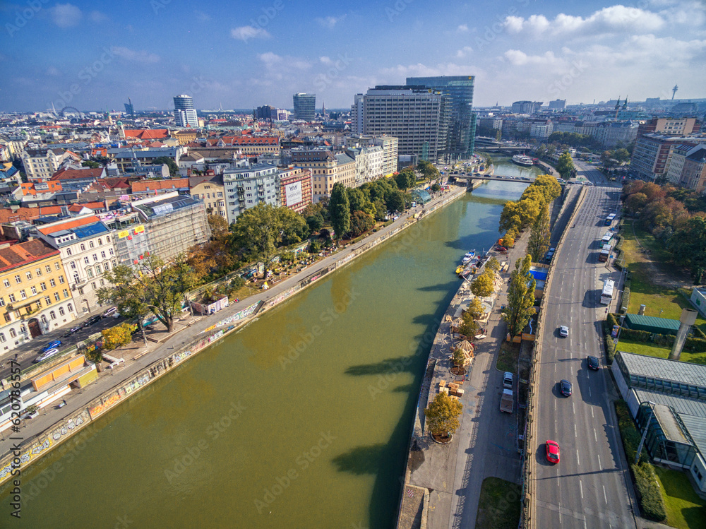 Danube River In Vienna Austria Ferry Cityscape In Background Stock danube-river-in-vienna-austria-ferry-cityscape-in-background-stock