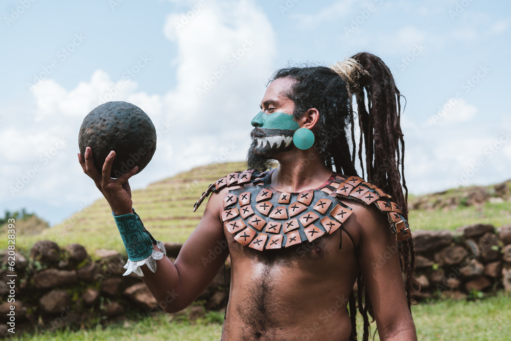 Mayan warrior looking at a rubber ball in pyramid background Stock ...