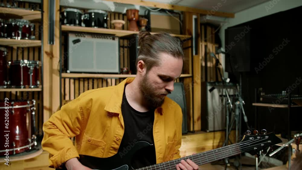Vidéo Stock portrait of young rock artist with electric guitar in ...