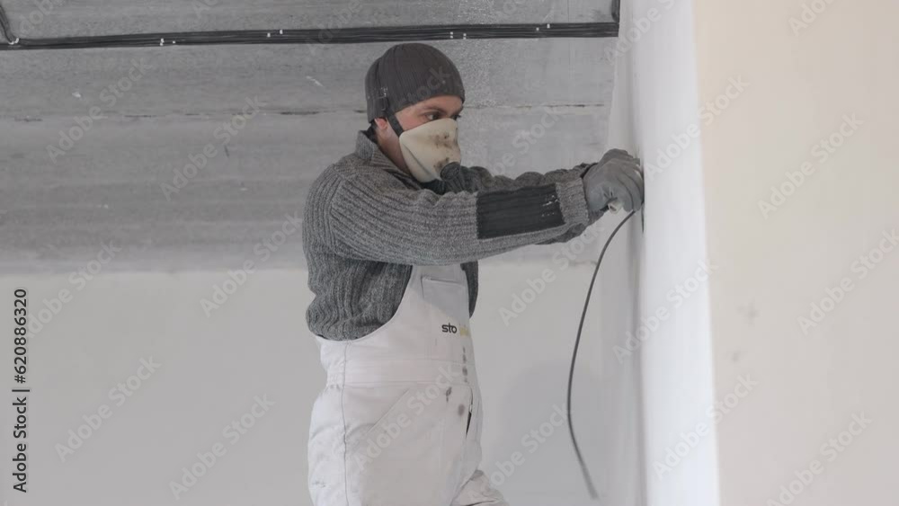 Electrician laying wiring cable, mounting electricity lines in the ...