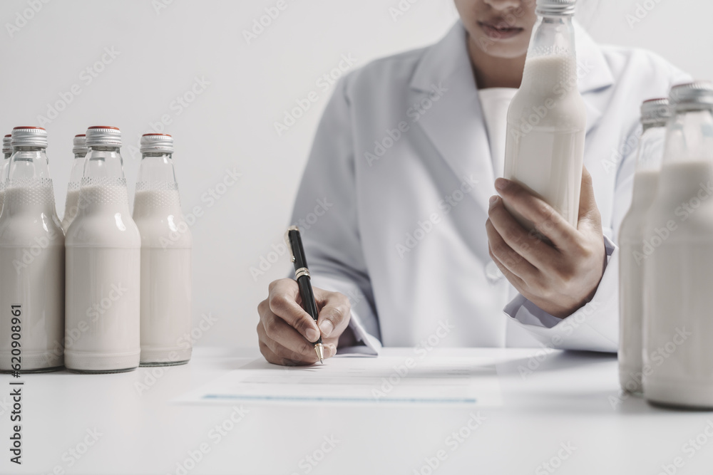 Quality control laboratory dairy factory professional people checking ...
