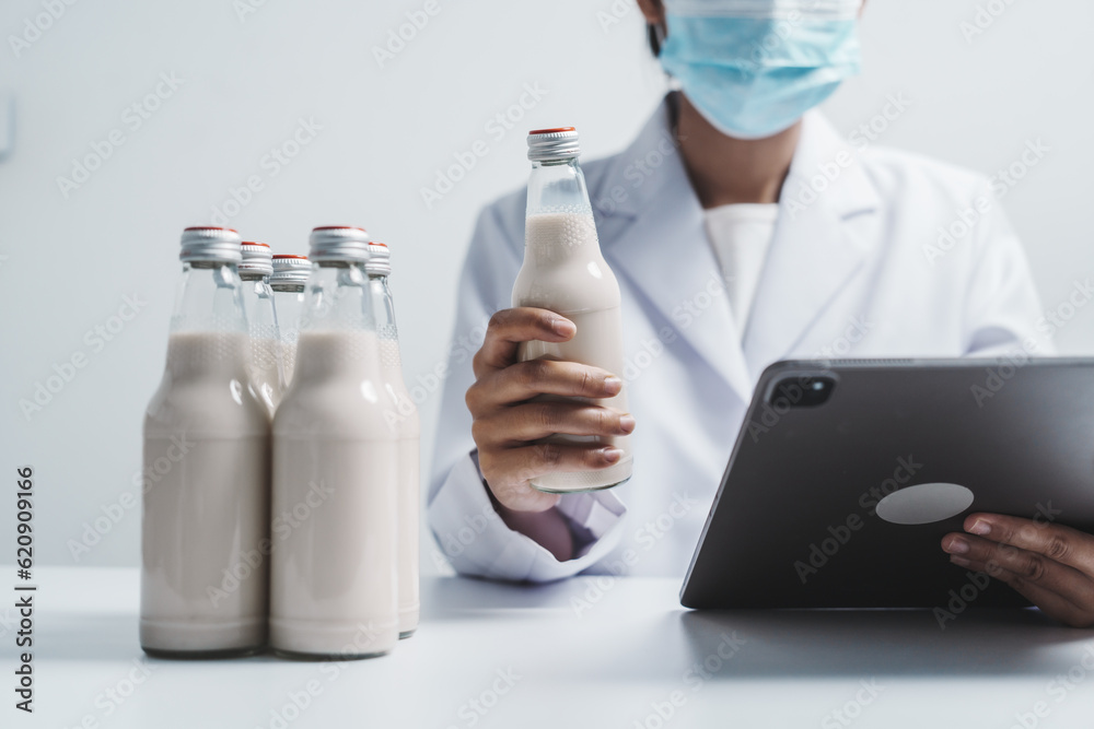Quality control laboratory dairy factory professional people checking ...