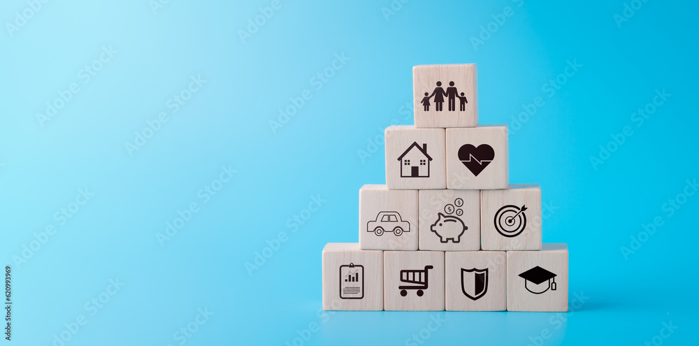 Wooden blocks with icons of various types of insurance. Life insurance ...