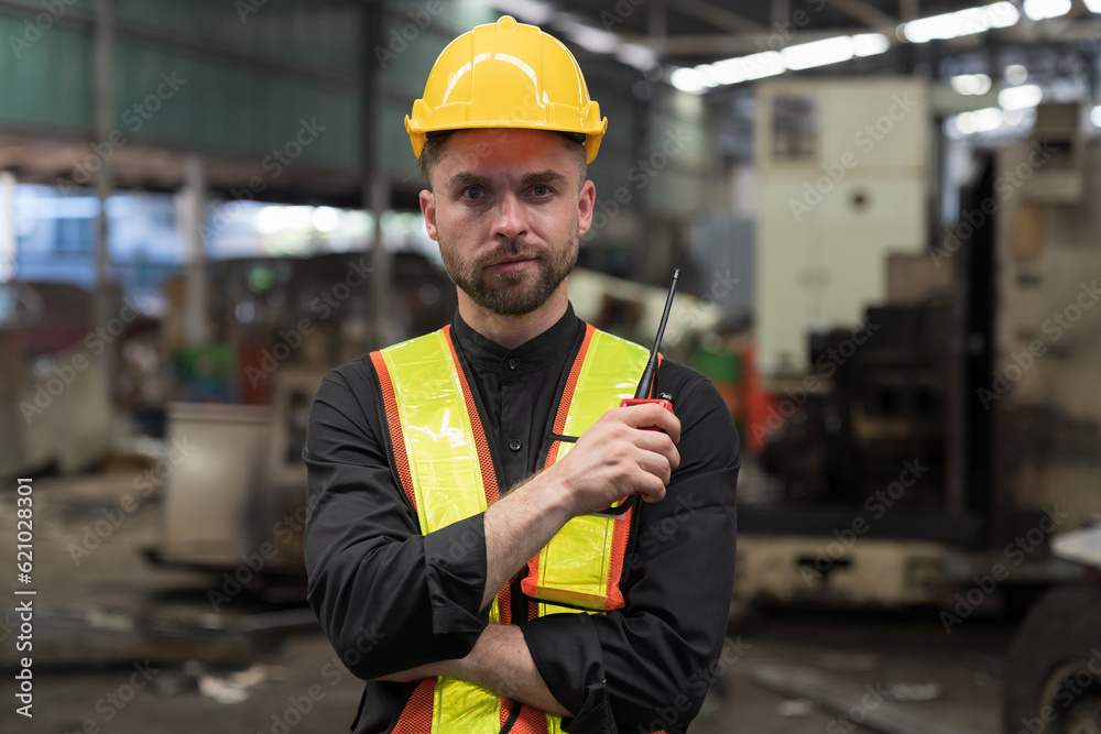 Portrait of male engineer worker working and control machine in factory ...