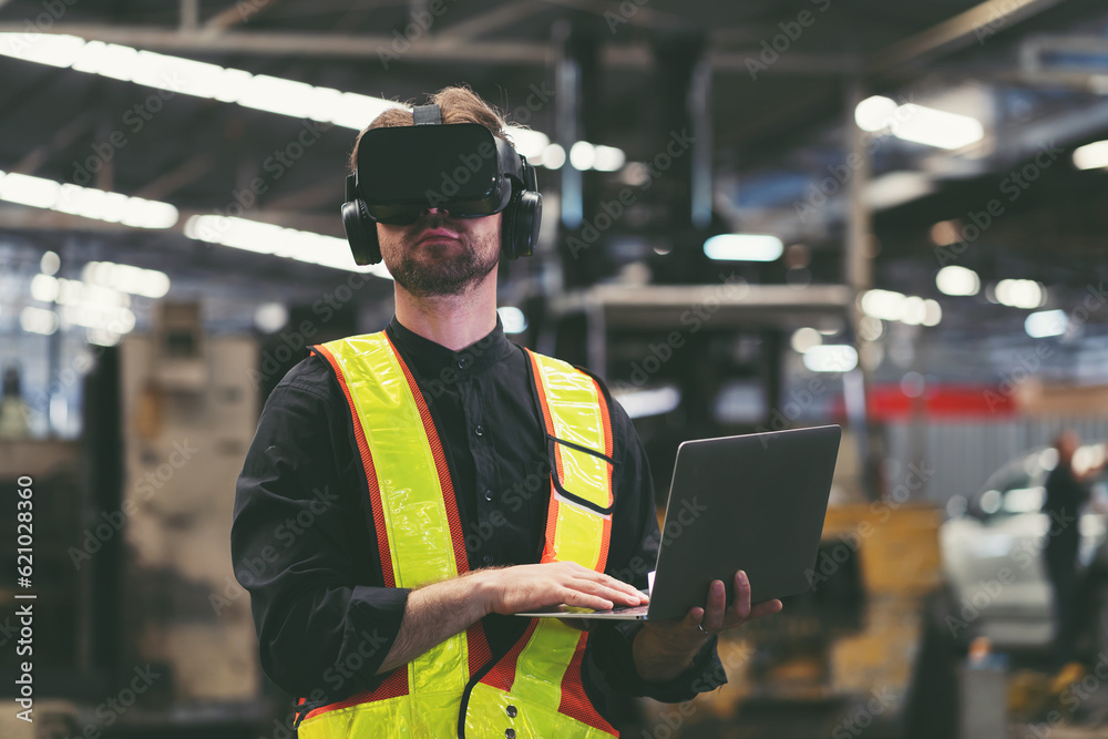 Male factory mechanic using virtual reality headset. Male engineer ...