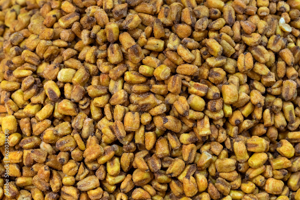 Roasted salted corn snack. Toasted corn nuts. Pattern of yellow corn ...