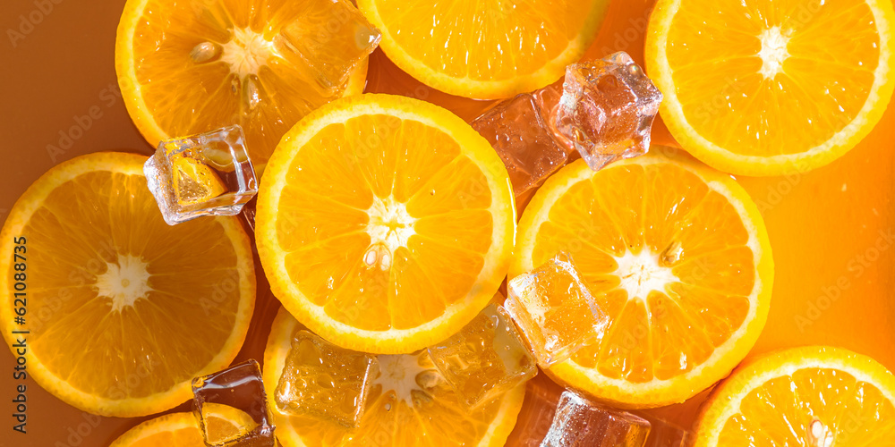 Orange slices and ice cubes with sparkling juice, fresh fruit lemonade with sparkling water and ...