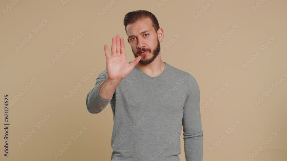 Vidéo Stock Lebanese man say No hold palm folded crossed hands in stop ...