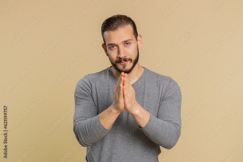Please, God help. Lebanese young man praying, looking upward and making ...