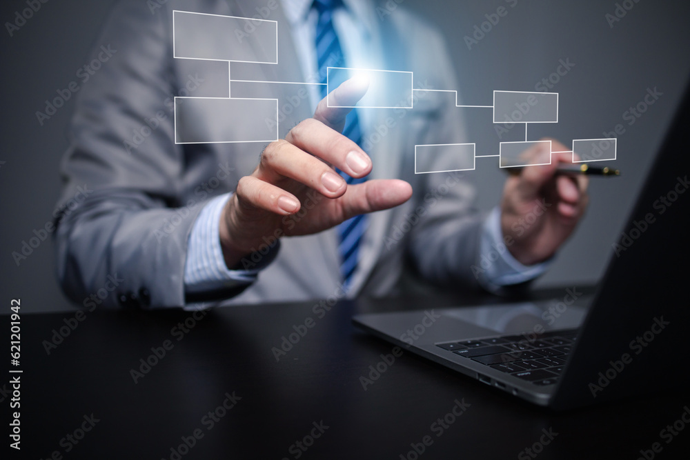 Person with hologram flowchart, businessman designing flowchart for ...
