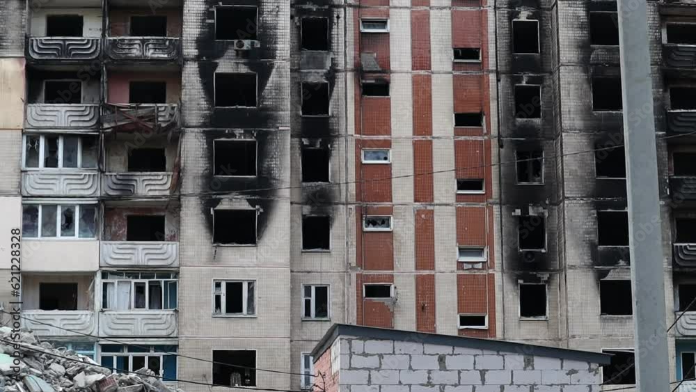 Facade of a residential abandoned multi-storey building after a strong ... Facade of a residential abandoned multi-storey building after a strong ...