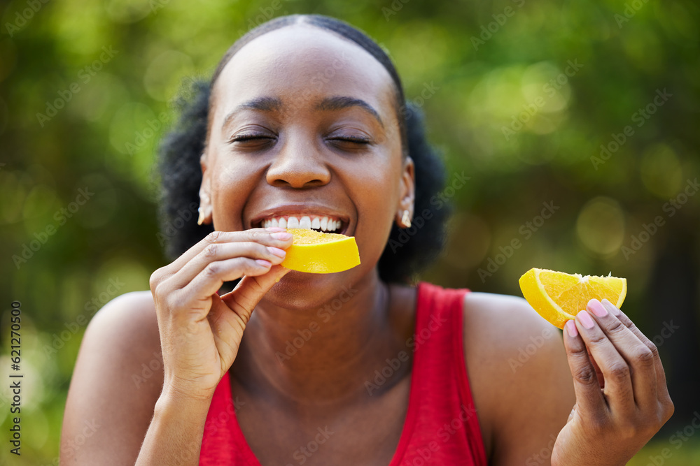 Black woman, vitamin C and eating orange slice for natural nutrition or ...