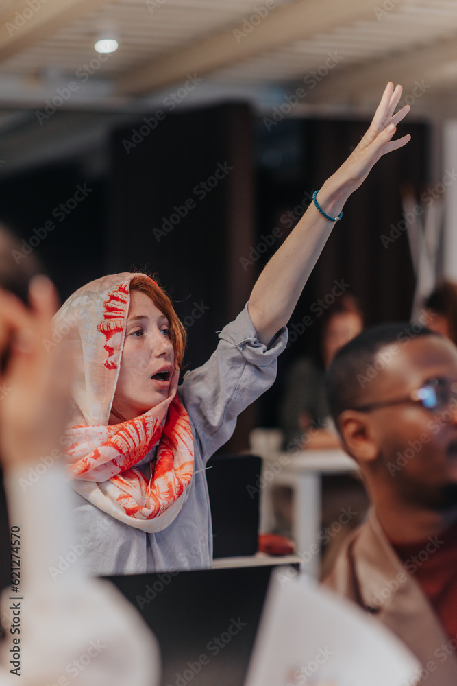 Muslim woman in hijab raising hand to ask question. Woman in hijab ...
