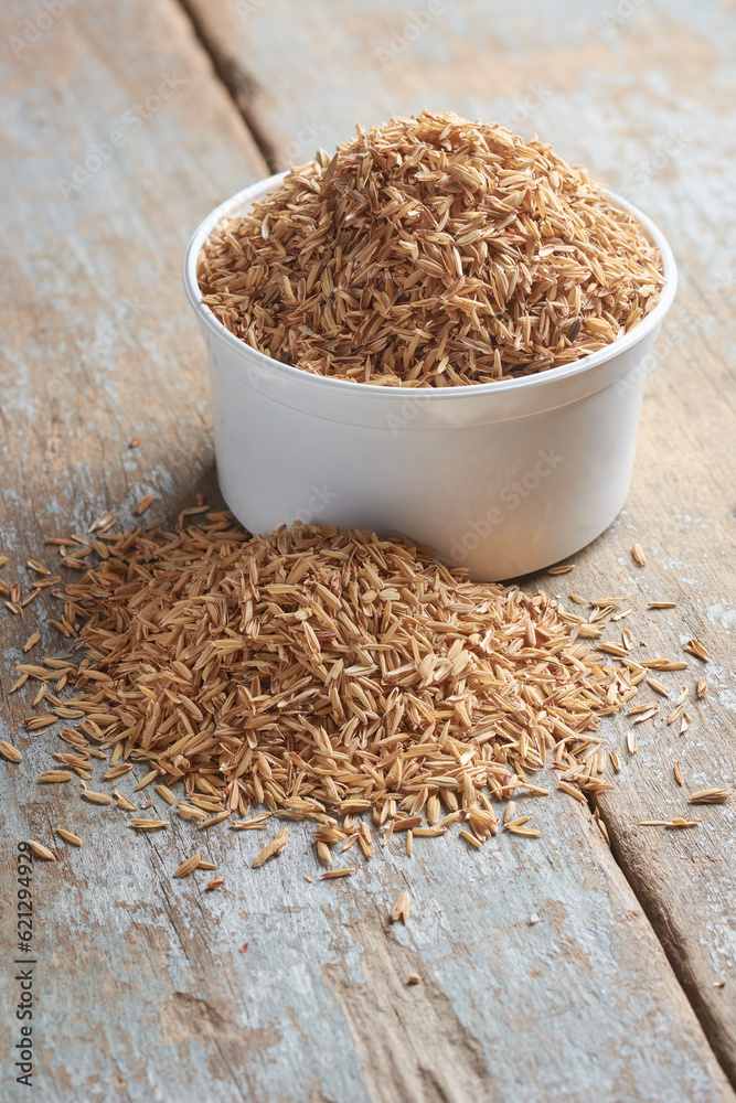 cup of paddy husk or rice husk, aka yellow rice chaff, rice husk or ...