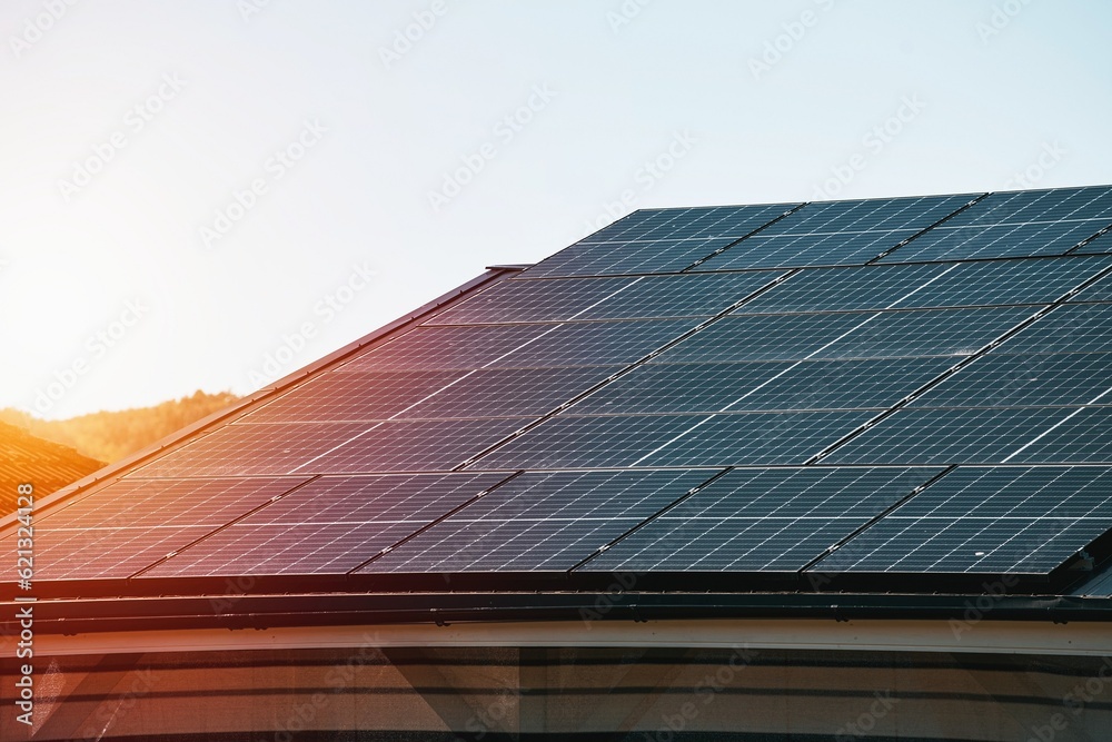 Solar panels on the roof of the modern house. Residential house cottage ...