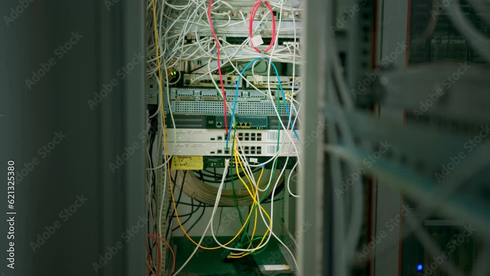 a bunch of patch network cables sorted in a rack cabinet leading from a ... a bunch of patch network cables sorted in a rack cabinet leading from a ...