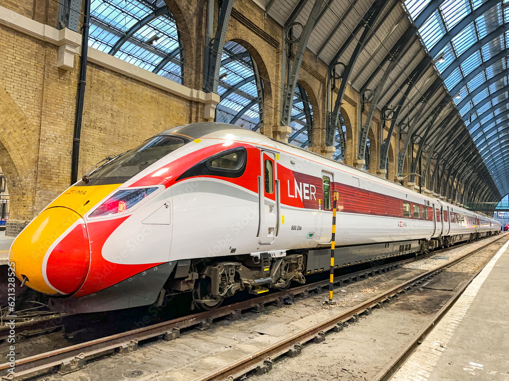 London, England, UK - 27 June 2023: High speed train alongside one of ...