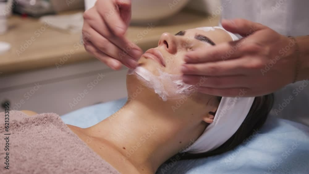 Side view portrait of young attractive woman on procedure for ...