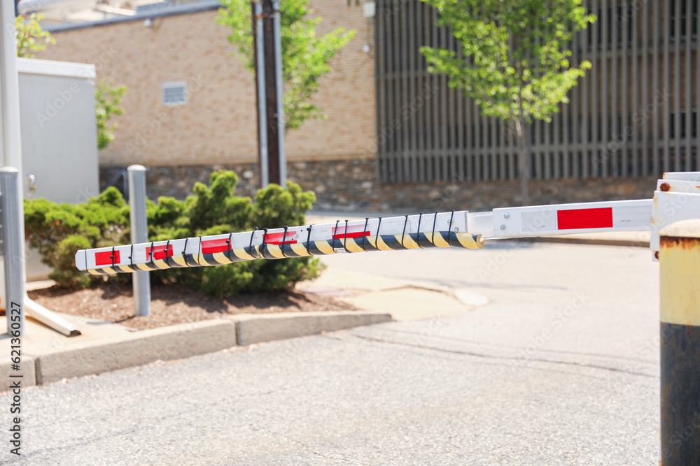 closed parking lot gate symbolizing restriction, boundaries, and ...