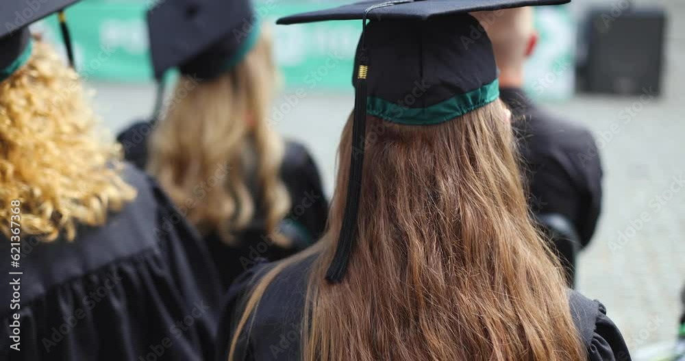 Graduation ceremony in university, female students wearing black ...