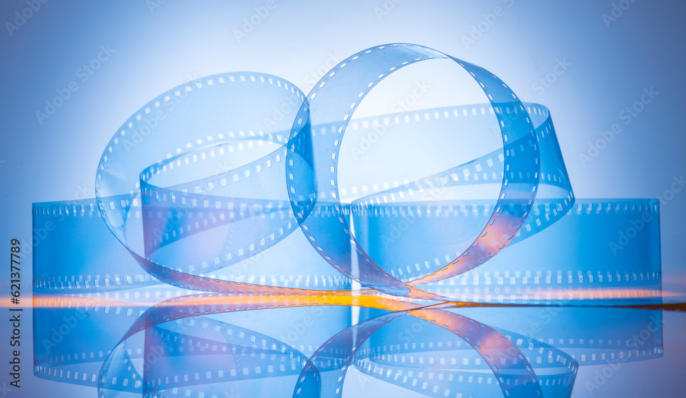 abstract colored cinematic background with film strip.background banner ...