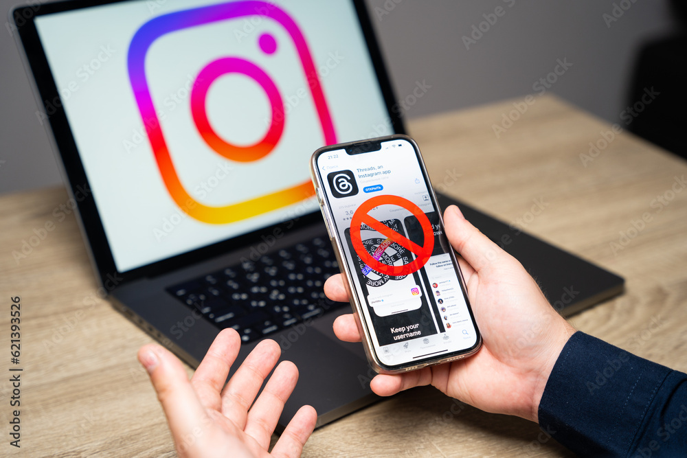 Hand holding a phone with Threads Instagram app and ban sign in the ...