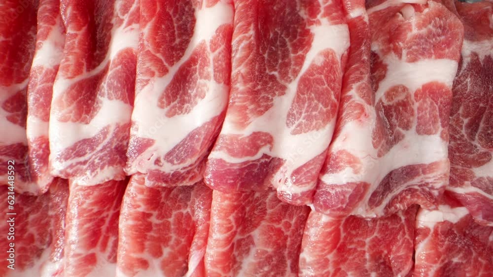 Raw pork neck slices are thin cuts of tender meat taken from the neck ...
