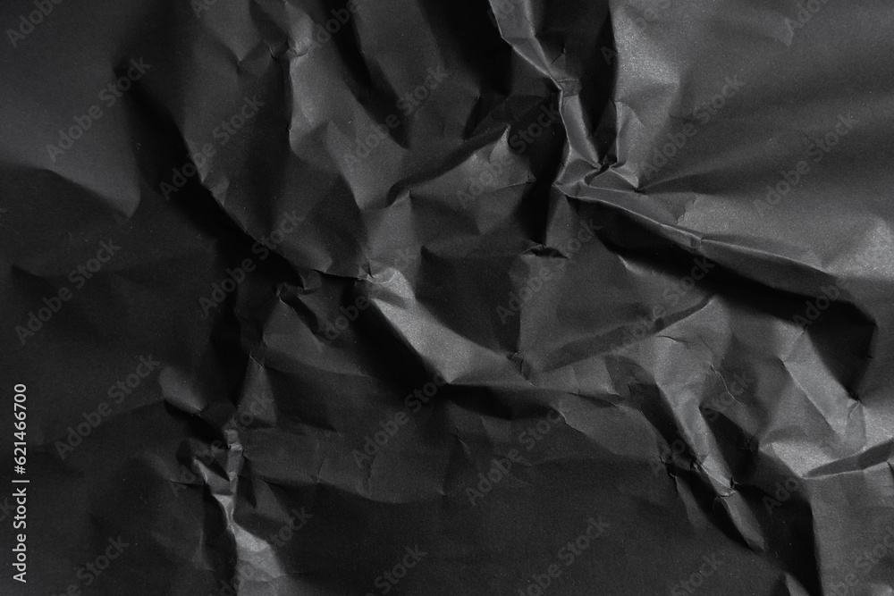 Black wrinkled paper texture in low light background Stock Photo ...