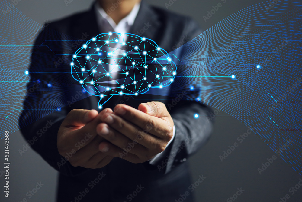 Businessman holding the human brain to research idea brain strom ...