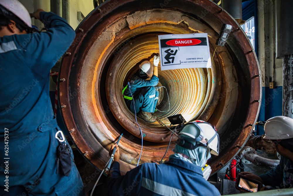 Male worker inspection measured the coil pipe circular thickness of the ...