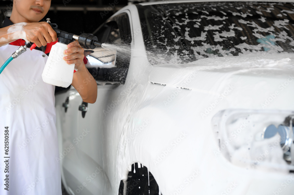 Man Worker use Foam Sprayer to Washing and Taking Care of Vehicle car ...