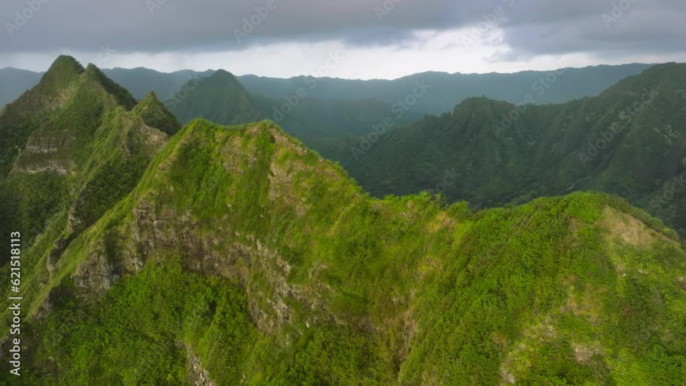 Incredible scenery of green and weird-shaped peaks over ocean coast ...