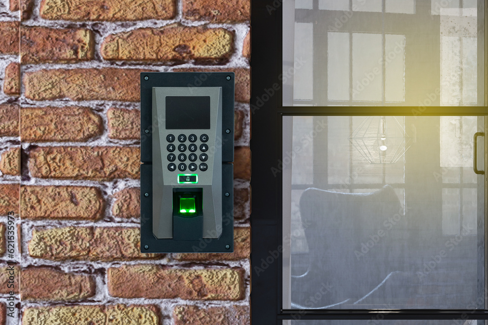 Finger print scan devices machine on brick wall for access door ...