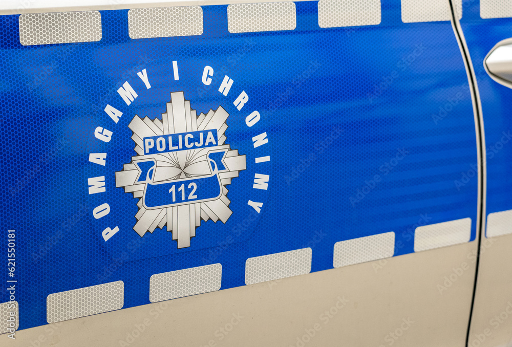 Polish Police blue logo symbol on the side of the police car, object ...