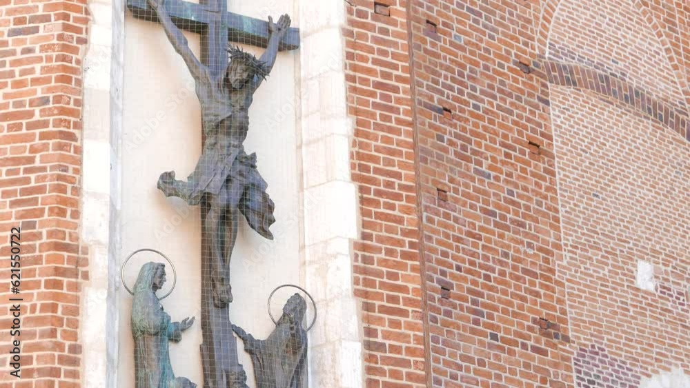 Jesus Christ on the cross figure, sculpture on Mariacki Church in ...