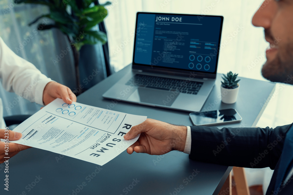 Confident man wearing suit in formal office, hand holding resume paper ...