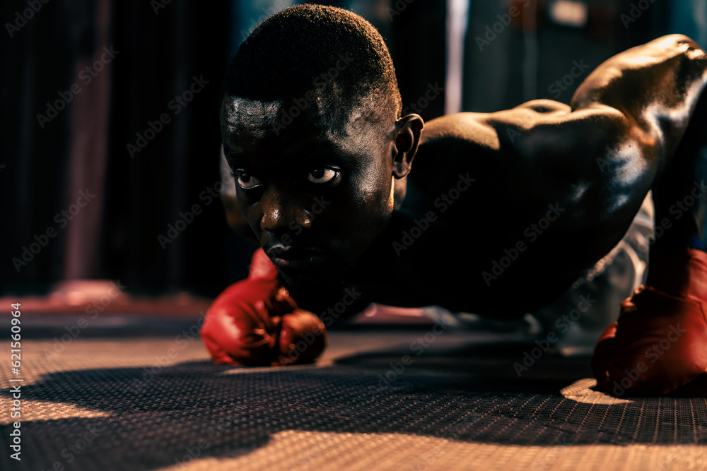 African American Black male boxer pushup and warmup before boxing ...