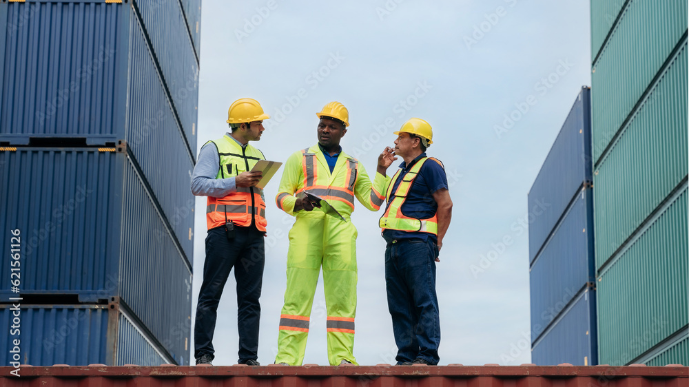 Foreman checking inventory or task details at Container cargo harbor ...