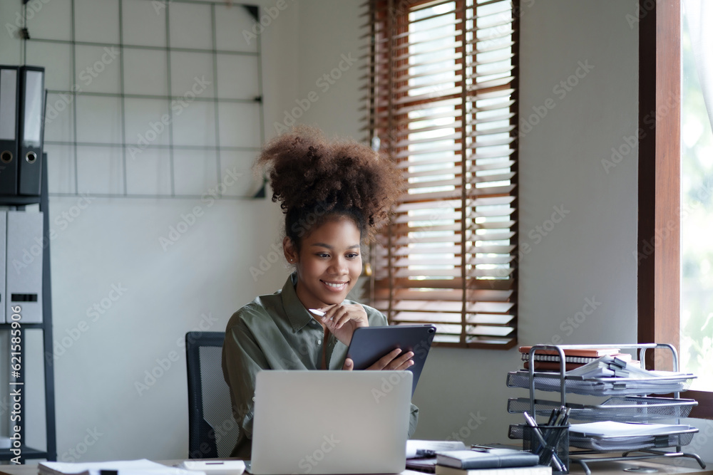 Young afro african american millennial employee trainee working on ...