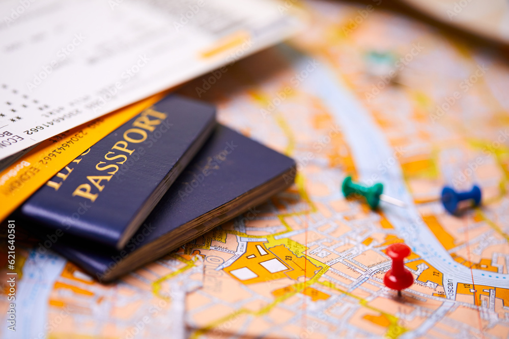pins marking travel itinerary points on map and passport Stock Photo ...