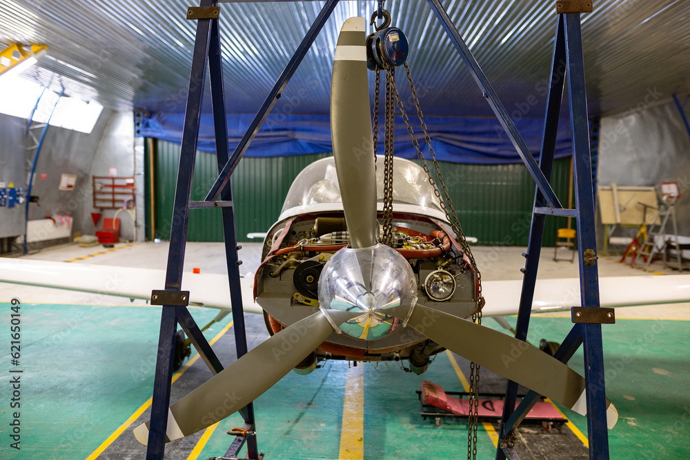 The hangar is a small business auto repair shop. Light single-engine ...