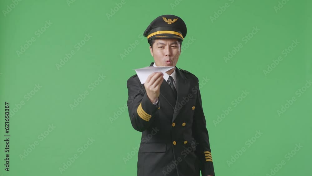 Asian Man Pilot In Professional Uniform Launching Paper Plane, Holding ...
