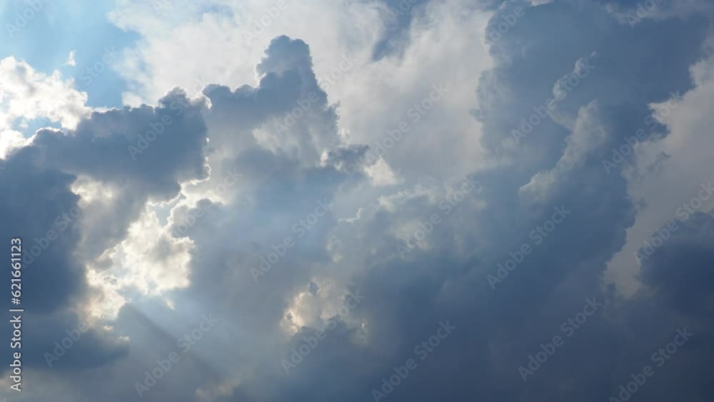 Beautiful clouds in the sky. Volumetric light effect. The sunrays are ...